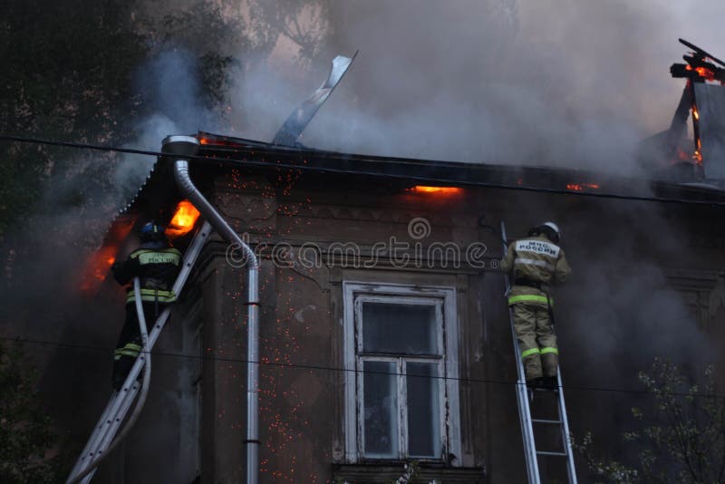 Firefighters Extinguish a Fire in an Old House Stock Photo - Image of ...