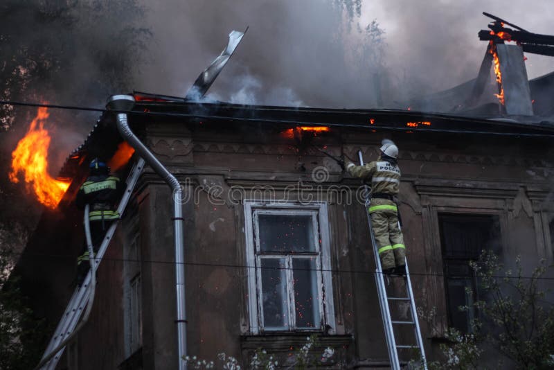 Firefighters Extinguish a Fire in an Old House Stock Photo - Image of ...