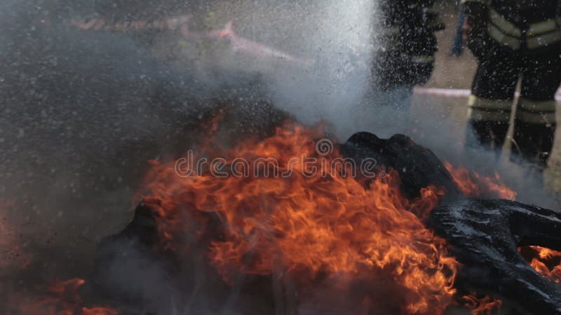 Firefighters Extinguish a Fire with Water Jet Stock Video - Video of ...