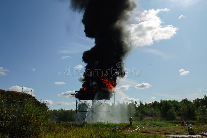 Firefighters Extinguish a Large Fire at the Factory. Stock Image ...