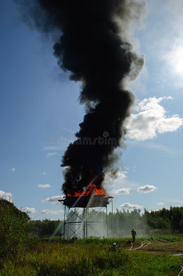Firefighters Extinguish a Large Fire at the Factory. Stock Photo ...