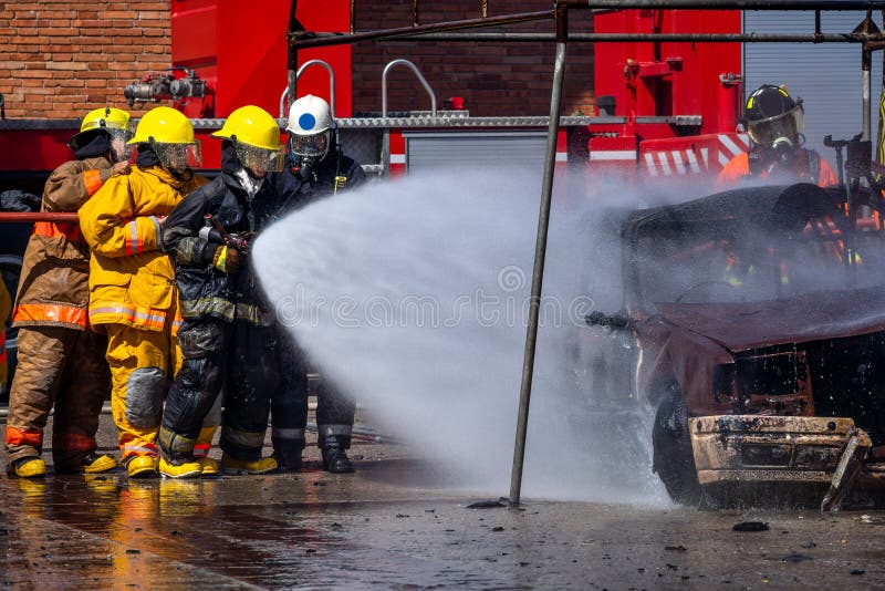 Firefighters Fighting Fire during Training with High Pressure Water To ...