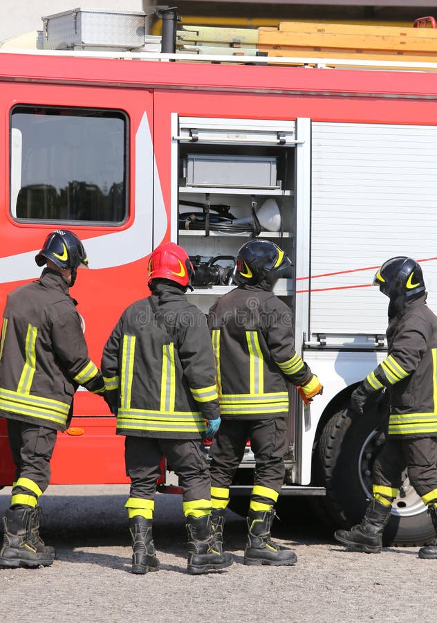 Firefighters with Fire Engine Truck Stock Photo - Image of teamwork ...