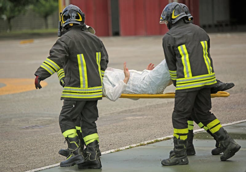 Rescuer Firefighter Stretcher Stock Photos - Free & Royalty-Free Stock ...