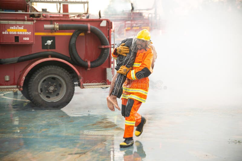 Firefighters Helping a Man Leave the Scorched and Smoky Place ...