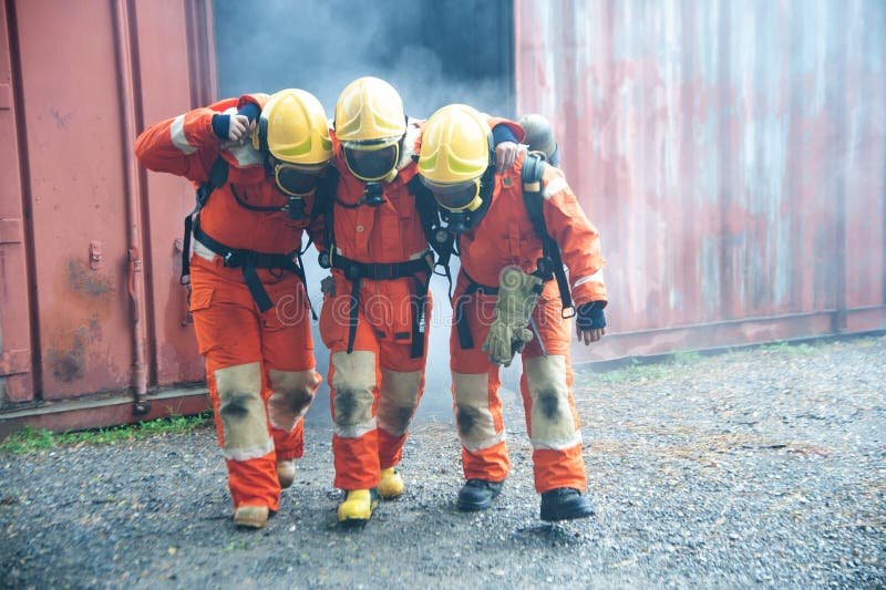 Firefighters are Helping People in a Burning and Smoky Building. Stock ...