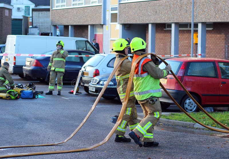 Firefighter Working with Fire Hose Editorial Stock Photo - Image of ...