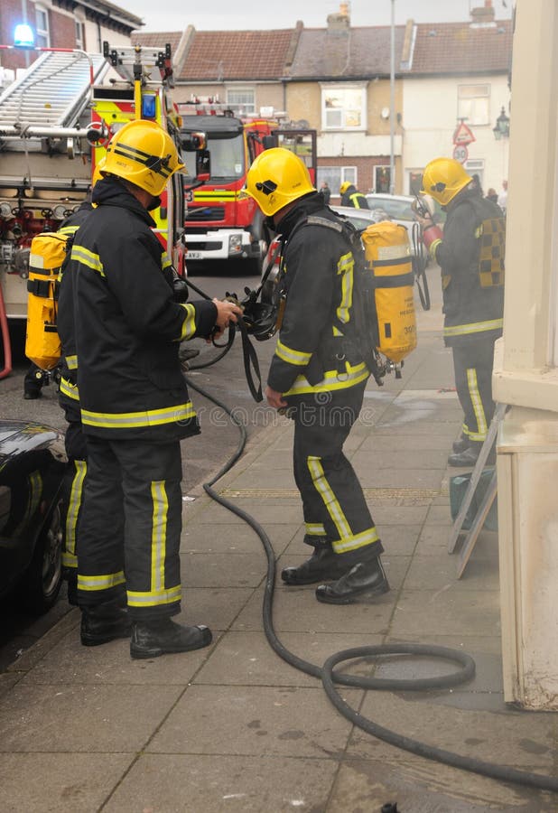 Firefighters at house fire editorial photography. Image of engine ...