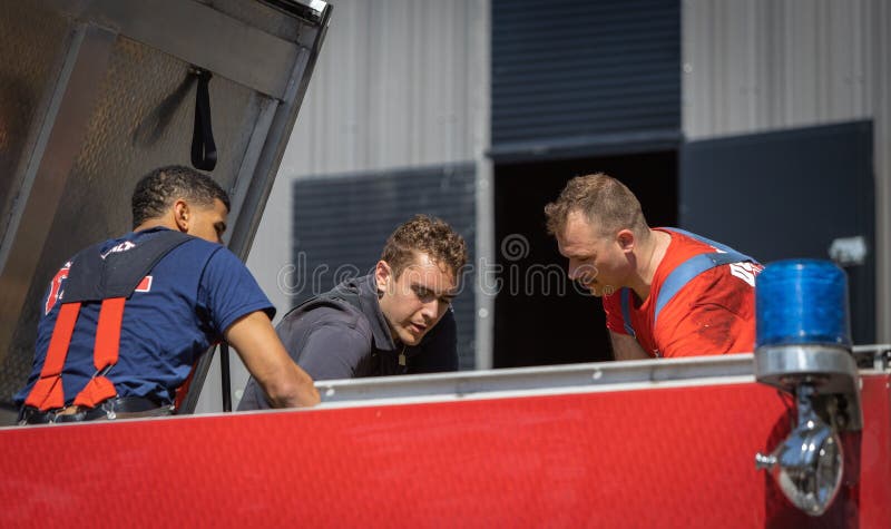 Firefighters Loading Hose Onto Fire Engine Editorial Image - Image of ...