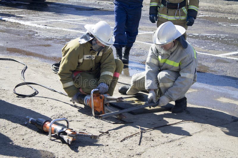 Firefighters at work. editorial photography. Image of victim - 145786847