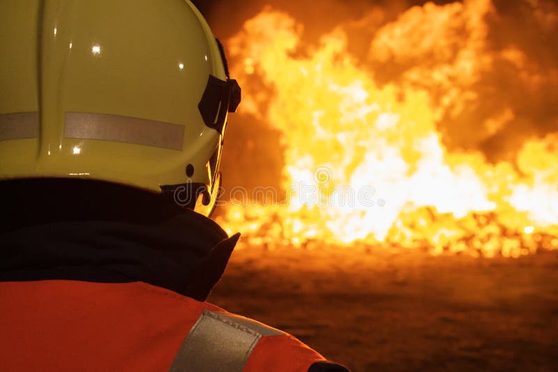 Firefighters Putting Out a Fire. Destruction and Disaster Stock Image ...