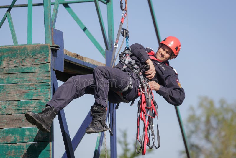 Fireman Climbing Expert During The Ascent Abseiling From A Build ...