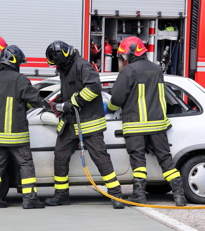 Firefighters Relieve an Injured after a Road Accident Stock Image ...