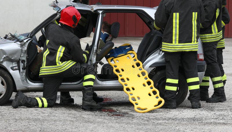 Firefighters on the Road after the Crash and the Stretcher Stock Image ...
