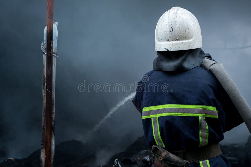 Firefighters Spray Water. Smoke and Buiding after Fire Editorial Image ...