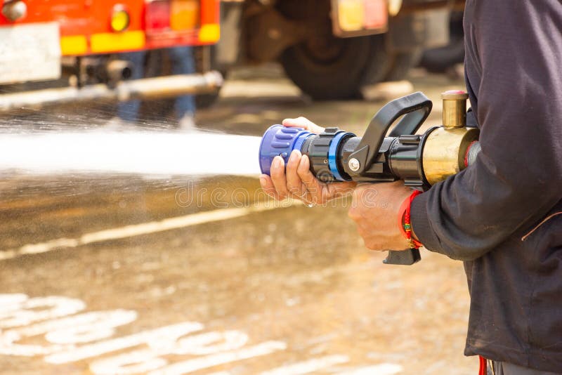 Firefighters Spray Water during a Training Stock Image - Image of hose ...