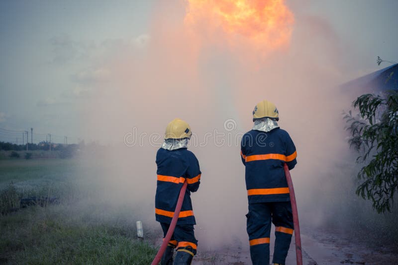Firefighters in Action ,Firefighters Training Stock Photo - Image of ...