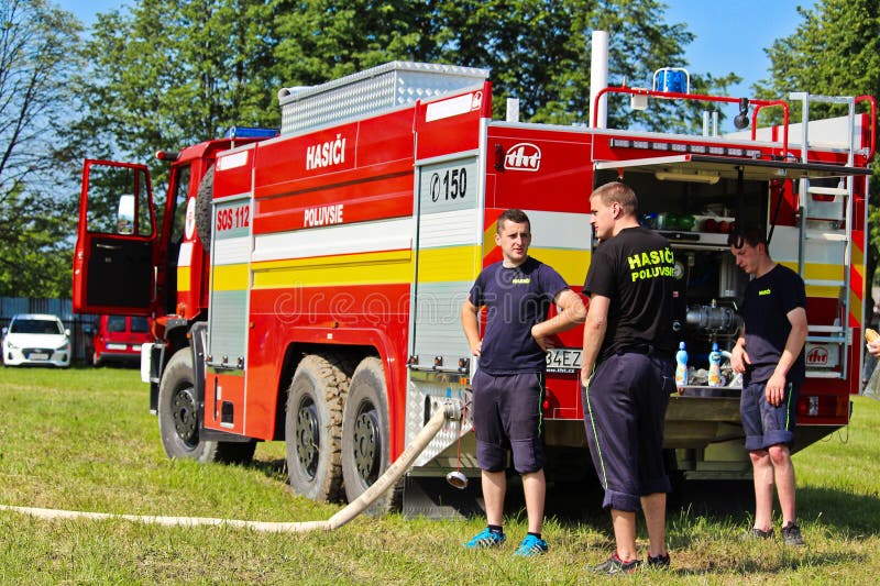 Firefighters Standing by Fire Engine during Daytime Editorial Stock ...