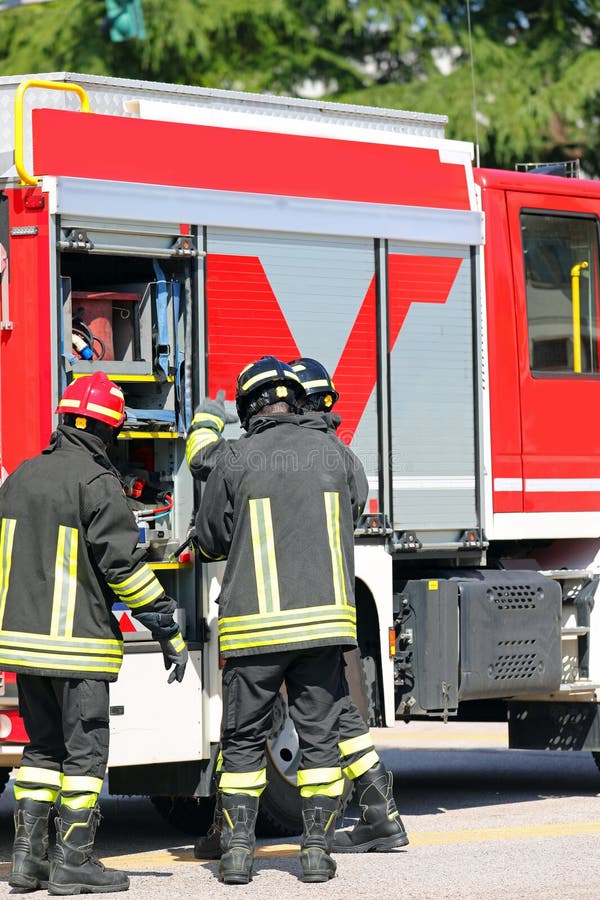 Firefighters Take Specialized Rescue Equipment from Red Fire Engine ...