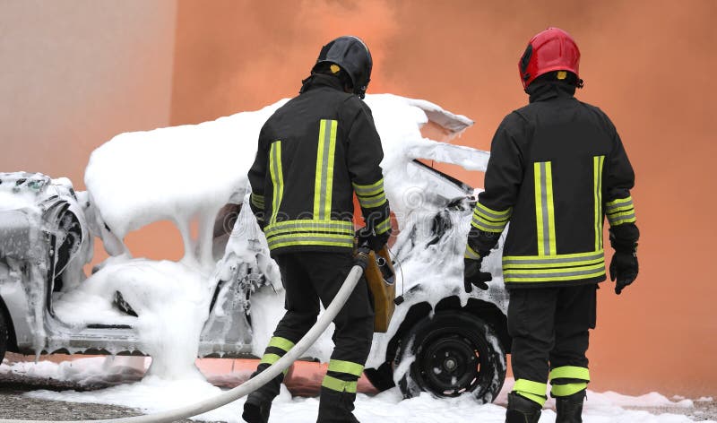 Firefighters Throw the Foam To Put Out the Fire of the Wrecked Car ...