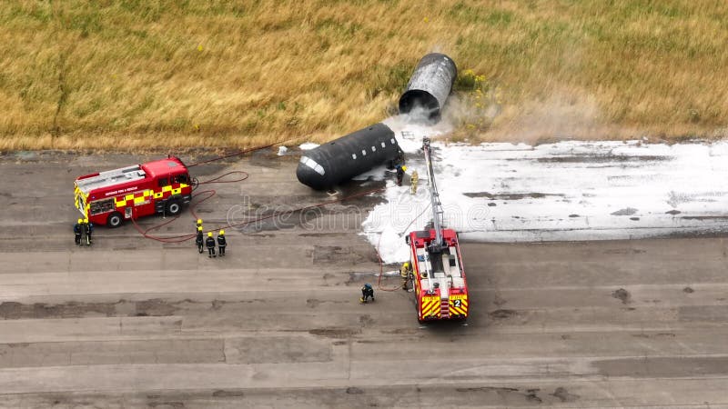 Firefighters Training To Tackle a Fire of a Dummy Aircraft Stock Video ...
