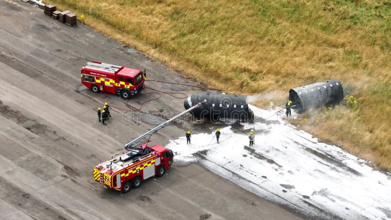 Firefighters Training To Tackle a Fire of a Dummy Aircraft Stock ...