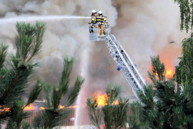 Firefighters Trying To Stop the Fire Surrounded by Heavy Smoke Stock ...