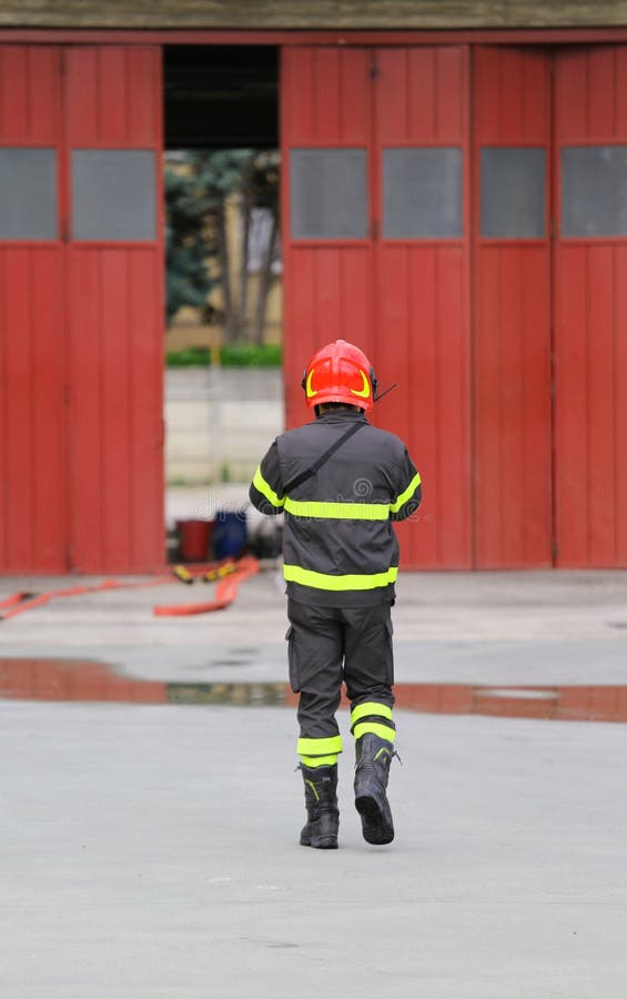 Firefighters in Uniform with Red Helmet Stock Photo - Image of brigade ...
