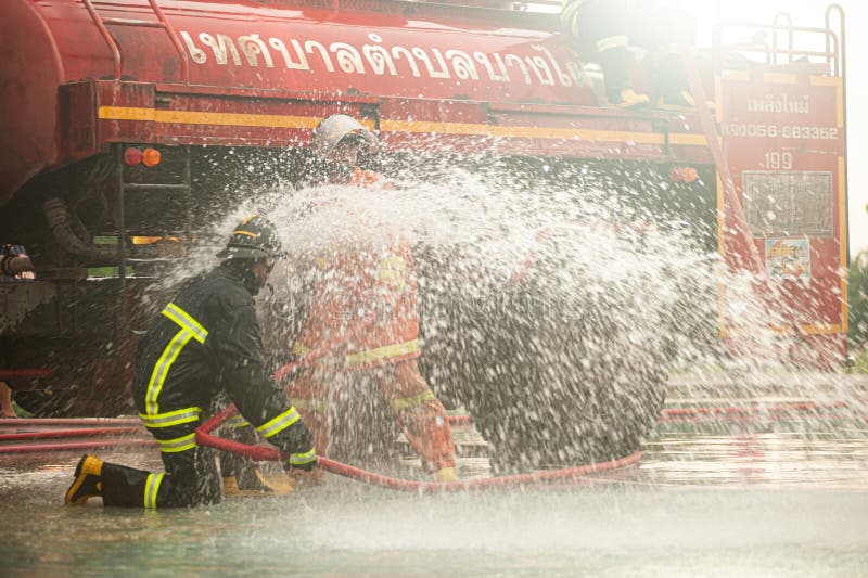 Firefighters Use Powerful Water To Extinguish the Fire. during the Fire ...
