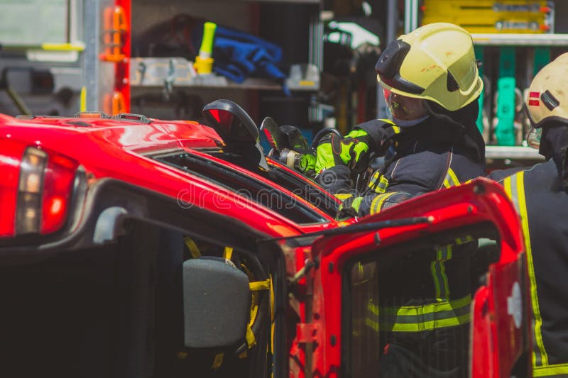 Firefighters Using a Hydraulic Jaws of Life Stock Photo - Image of ...