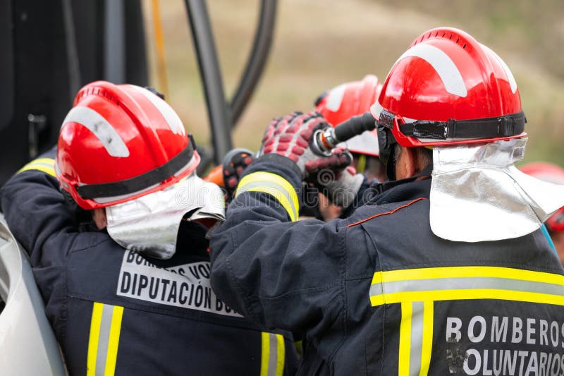 Firefighters Using Hydraulic Tools during a Rescue Operation Training ...