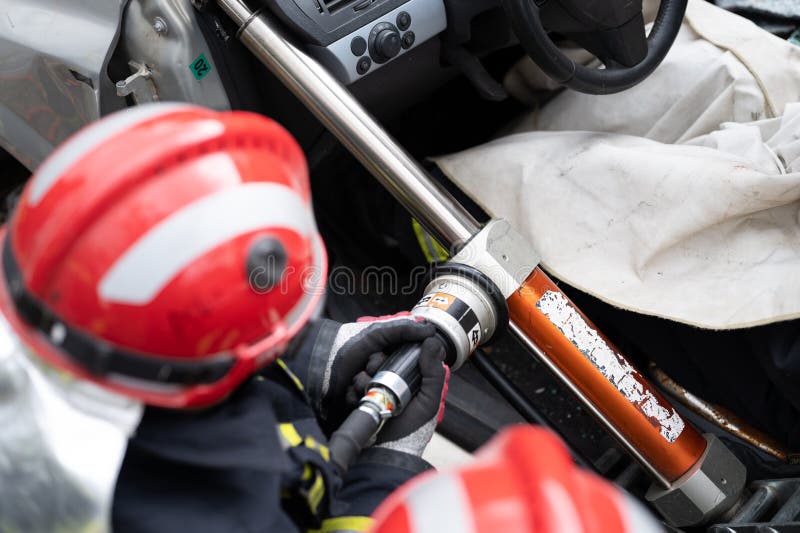 Firefighters Using Hydraulic Tools during a Rescue Operation Training ...