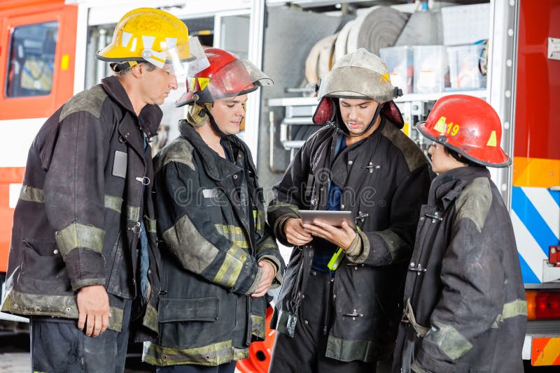 Firefighters Using Tablet Computer at Fire Station Stock Image - Image ...