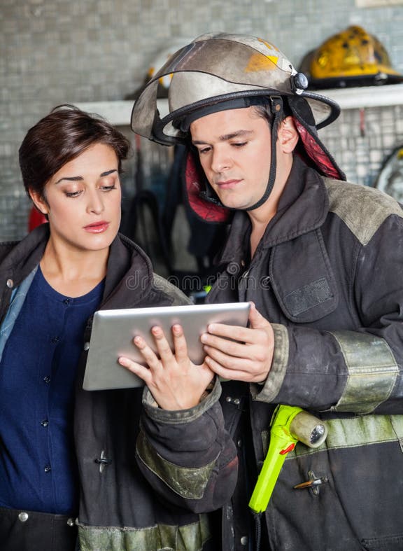Firefighters Using Tablet Computer Stock Photo - Image of plan ...