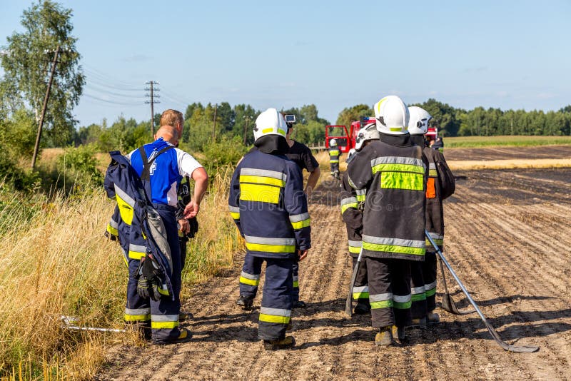 Firefighters Walking on the Field on Fire Editorial Photography - Image ...
