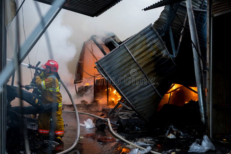Firefighters Work on an Fire of Building Using a Metal Cutter Rescue ...