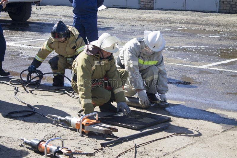 Firefighters at work. editorial image. Image of exercise - 145786865