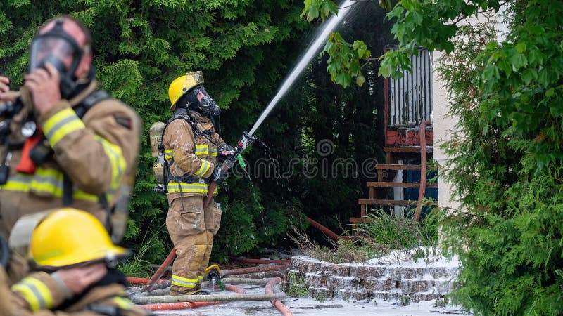 Firefighters at Work during a House Fire Editorial Photography - Image ...