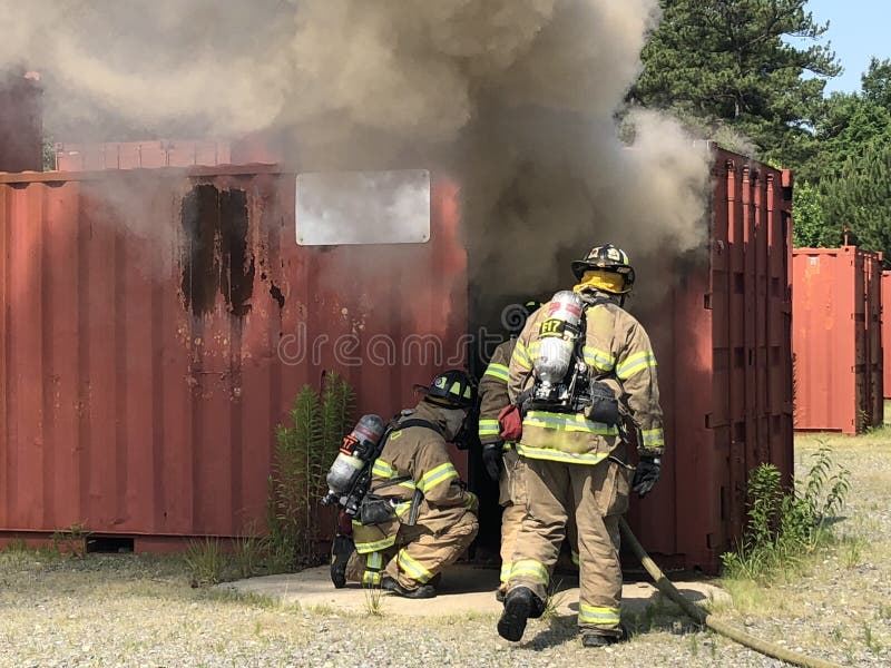 Firefighters Prepare To Enter Training Scenario Stock Image - Image of ...