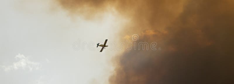 Firefighting Plane Flying into a Large Cloud of Smoke Stock Image ...