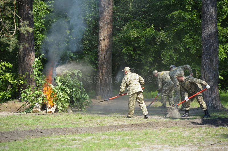 Firefighting Team Training: Firemen in Protective Ensembles Fighting ...