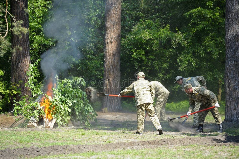 Firefighting Team Training: Firemen in Protective Ensembles Fighting ...