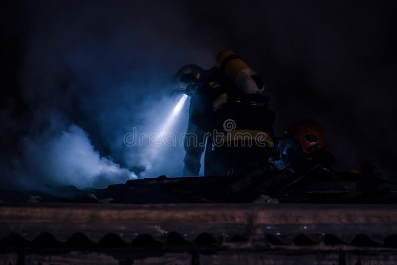 Fireman in action editorial stock image. Image of action - 138290524