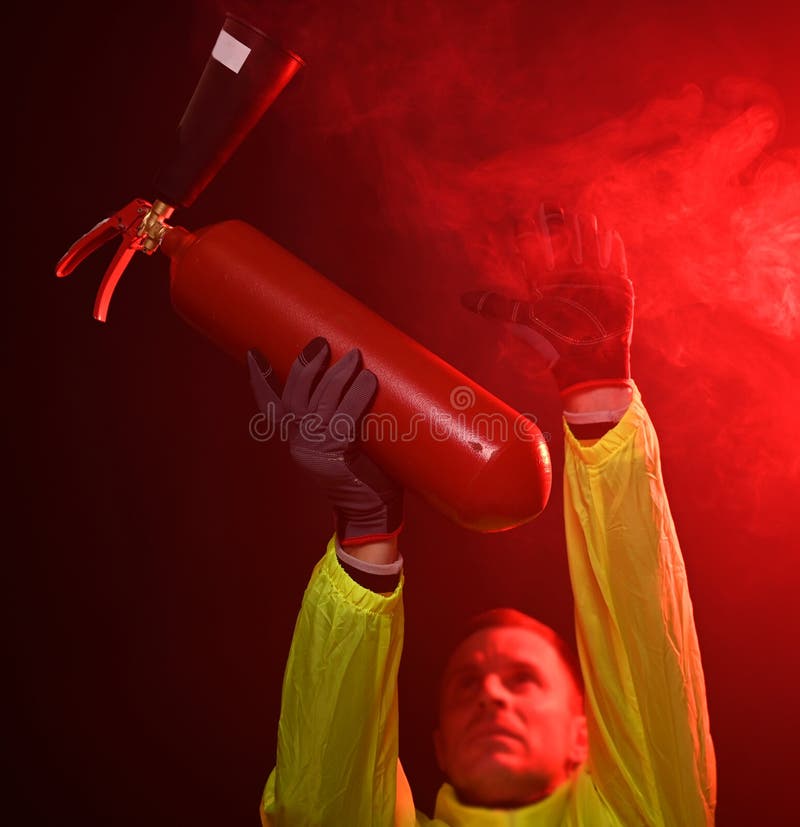 Fireman Attacking a Fire with Extinguisher Stock Image - Image of adult ...