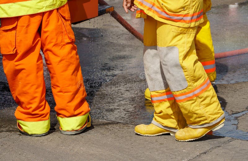 Fireman Attacking a Fire with Water. Firefighter Team Work Stock Photo ...