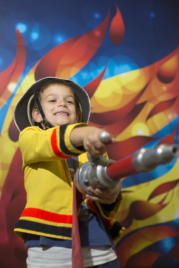 Fireman boy stock image. Image of spray, helmet, protective - 51202479