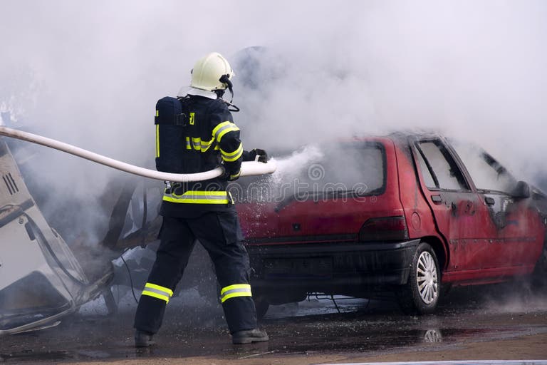 Fireman at car fire stock image. Image of professional - 28163507