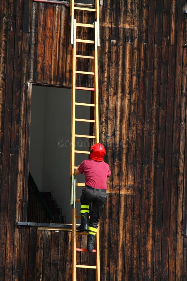 Fireman during a Demonstration of Using the Ladder To Reach the Stock ...