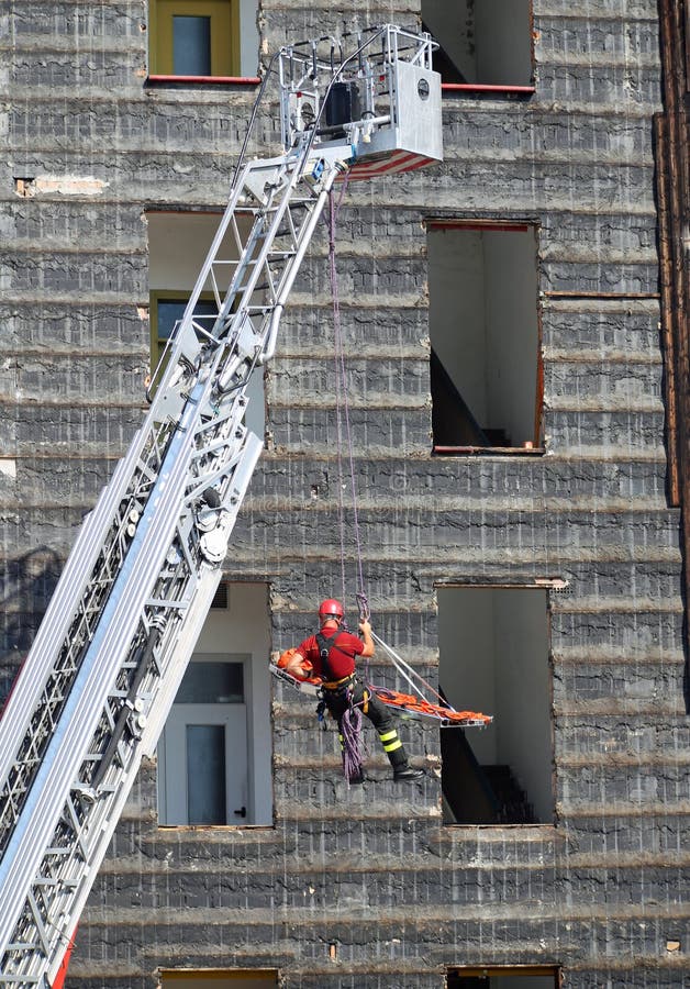 Fireman during an Exercise Carries the Stretcher with the Rope Stock ...