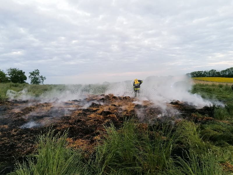 Fireman Extinguishes Fire in the Hallway Stock Photo - Image of ...